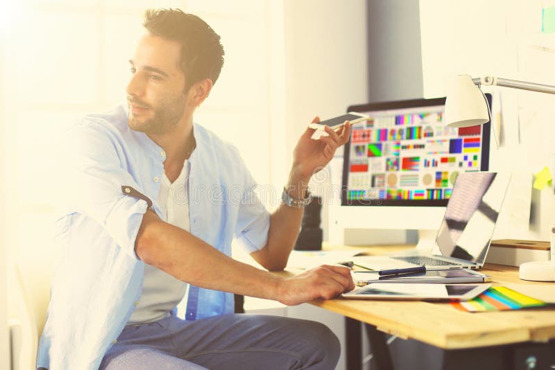 Portrait of Young Designer Sitting at Graphic Studio in Front of Laptop ...