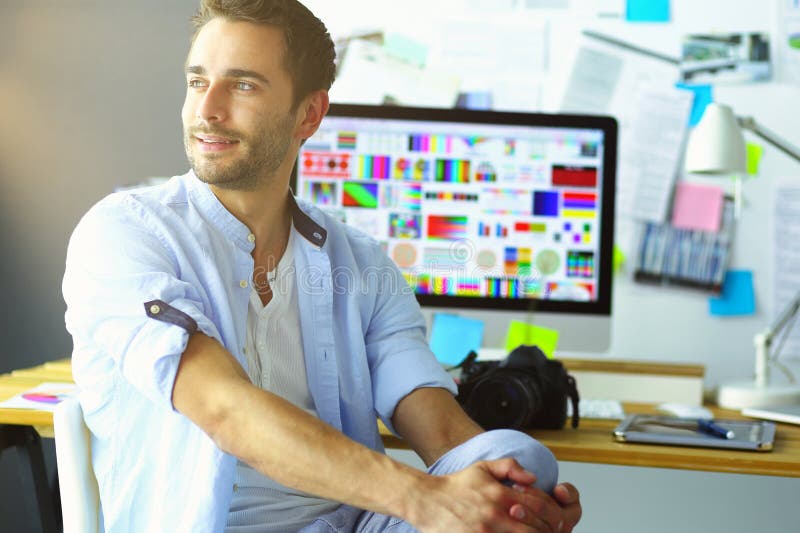 Portrait of Young Designer Sitting at Graphic Studio in Front of Laptop ...