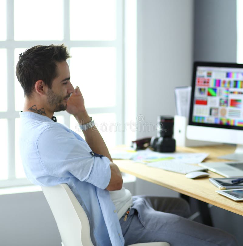 Portrait of Young Designer Sitting at Graphic Studio in Front of Laptop ...