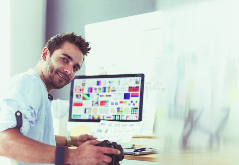 Portrait of Young Designer Sitting at Graphic Studio in Front of Laptop ...