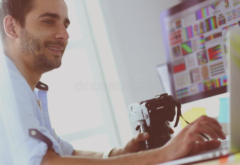 Portrait of Young Designer Sitting at Graphic Studio in Front of Laptop ...