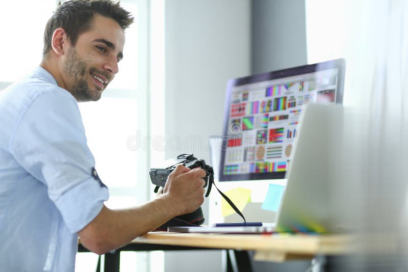 Portrait of Young Designer Sitting at Graphic Studio in Front of Laptop ...