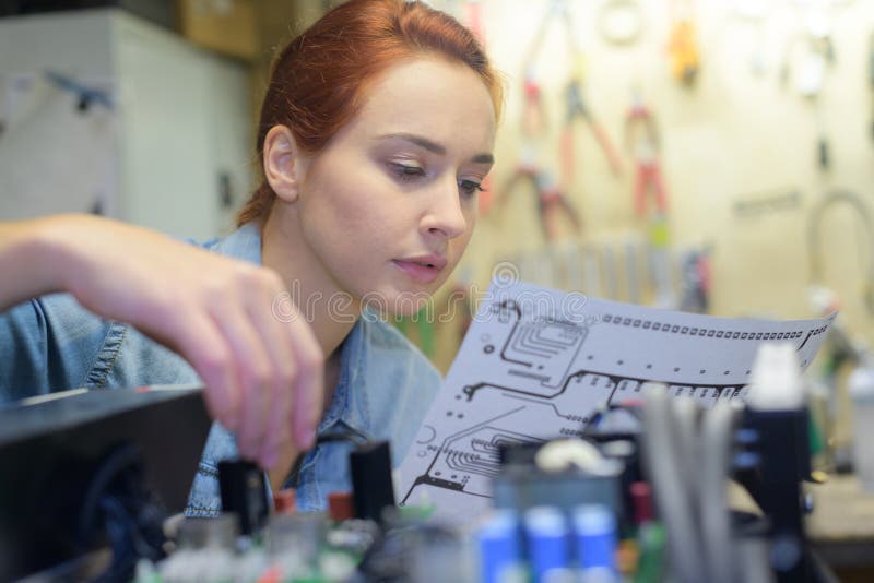 Young Woman Technician Repair Electronics Device Toned Image Stock ...