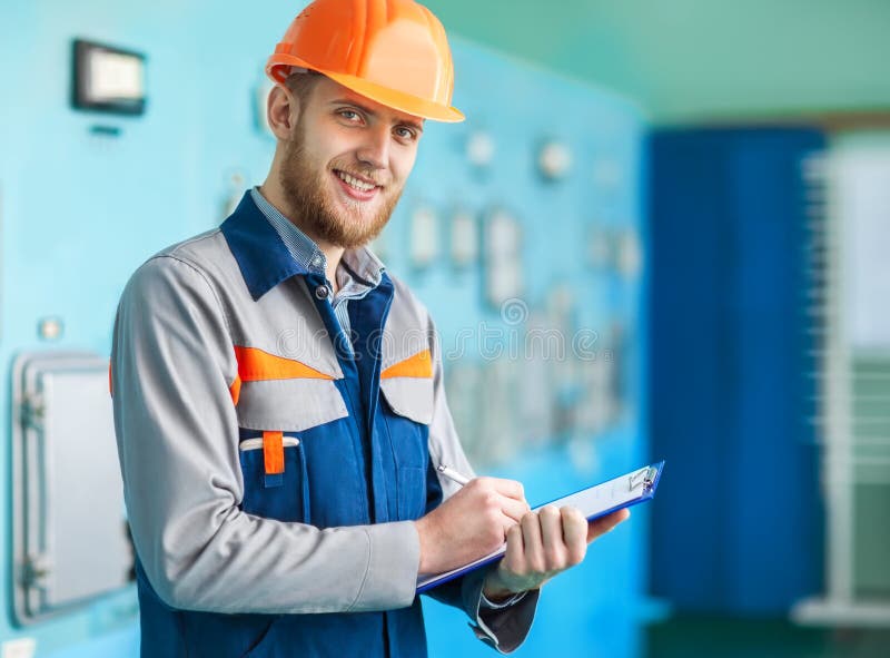 Portrait of Young Engineer Taking Notes at Control Room Stock Image ...