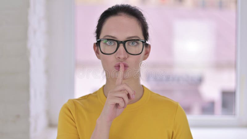 Portrait of Young Female Designer Putting Finger on Lips Stock Image ...
