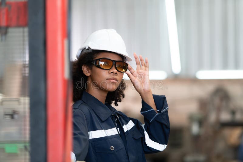 Portrait of a Young Female Engineer in the Welding Robot Industry Stock ...