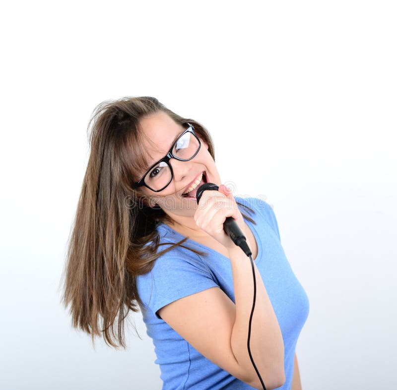 Portrait of a Young Female with Microphone Against White Background ...
