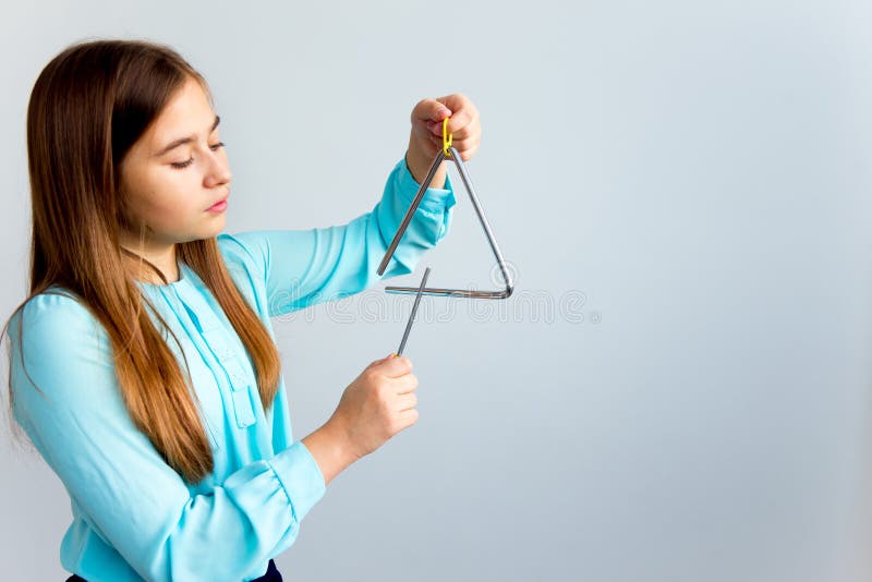 Child Playing Triangle Instrument Stock Photos - Free & Royalty-Free ...