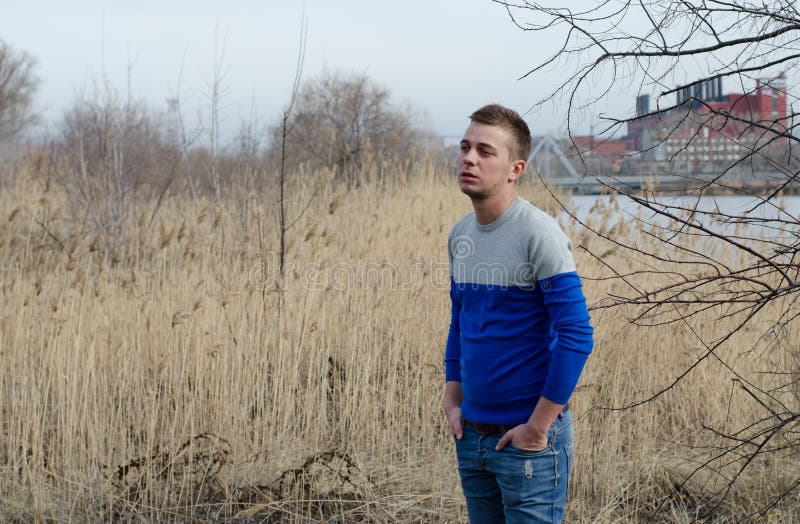 Portrait of a Young Guy on a Background of Trees in Spring Stock Photo ...