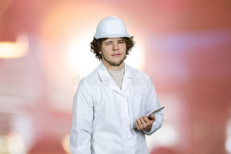 Portrait of a Young Guy in White Uniform Holding Tablet Pc Device ...