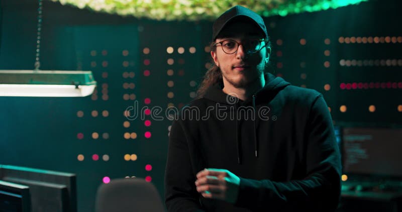 Portrait of a Young Hacker Looking at the Camera in a Secret Hideout in ...