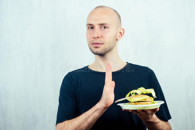 A Young Balding Bald Man Yells and Screams Holding His Head. the ... A Young Balding Bald Man Yells and Screams Holding His Head. the ...