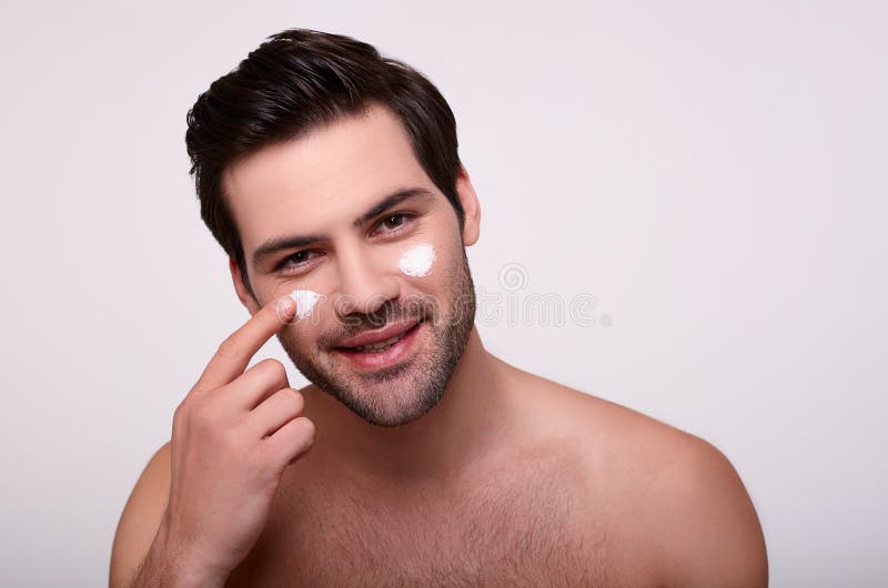 Portrait of Young Handsome Man Applying Cream Lotion on Face Stock ... Portrait of Young Handsome Man Applying Cream Lotion on Face Stock ...