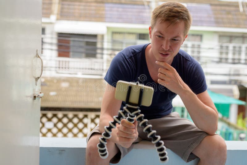 Portrait of Young Handsome Man Vlogging at Home Stock Photo - Image of ...