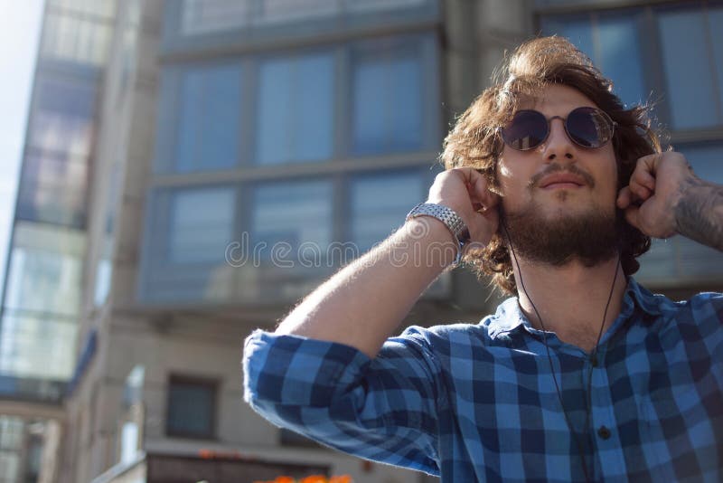 Guy in Sunglasses Enjoying the Music. Portrait of Young Handsome ... Guy in Sunglasses Enjoying the Music. Portrait of Young Handsome ...