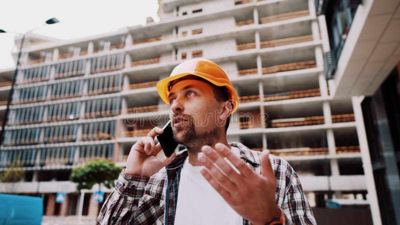 Engineer Talking on Phone. Architect Using Phone on Construction Site ...