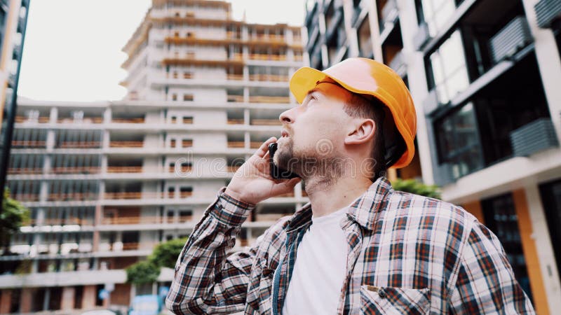 Engineer Talking on Phone. Architect Using Phone on Construction Site ...