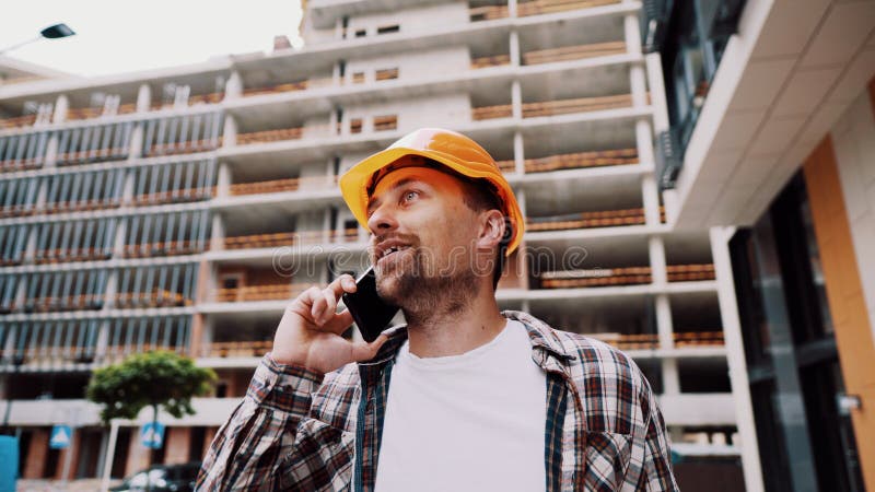 Engineer Talking on Phone. Architect Using Phone on Construction Site ...