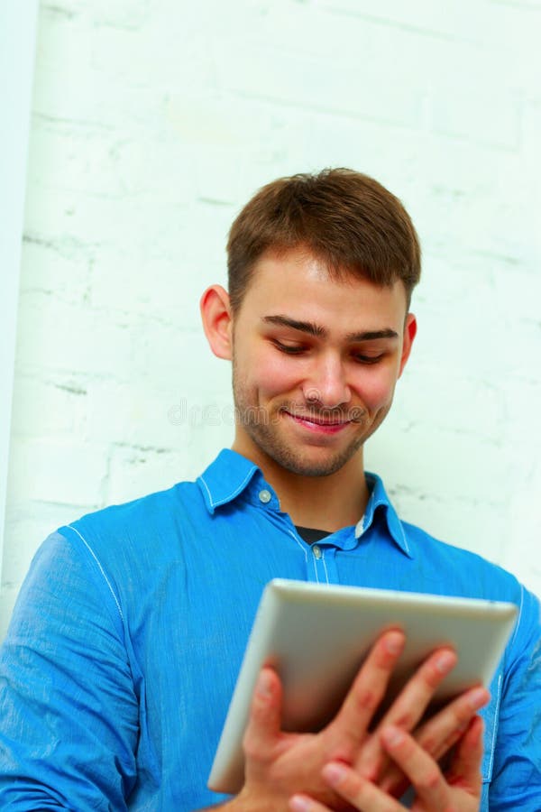 Young Man Holding Ipad Notebook Stock Photo - Image of lifestyle ...