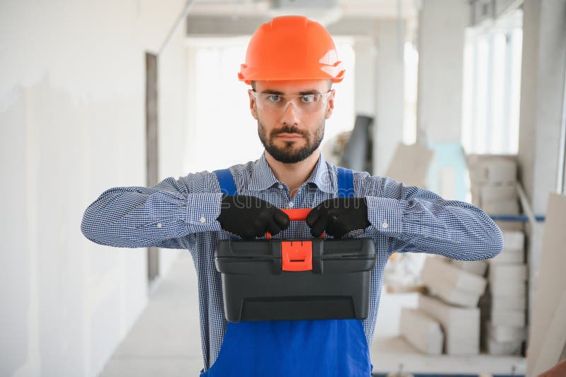 Portrait of Young and Hardworking Constructor Posing in Big Unfinished ...