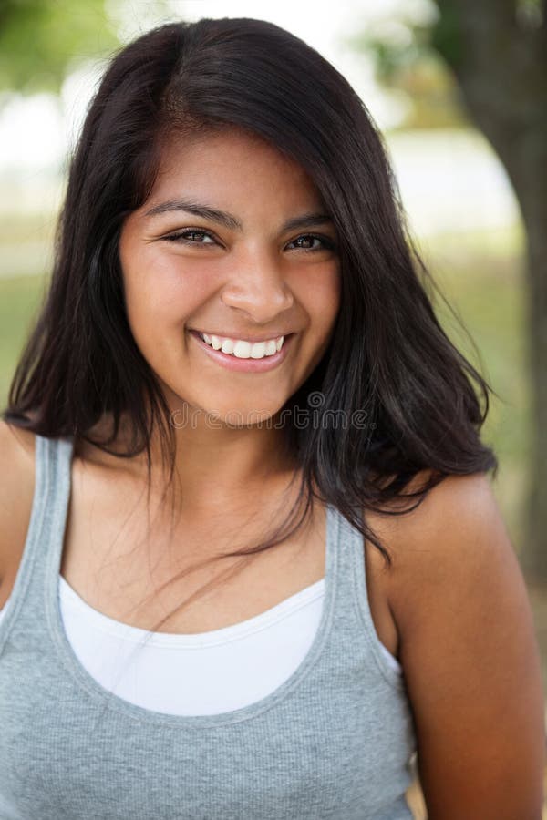Young Hispanic Girl Smiling Outside. Stock Image - Image of people ... Young Hispanic Girl Smiling Outside. Stock Image - Image of people ...