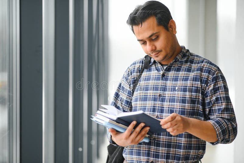 Portrait of a Young Indian Male Student Stock Photo - Image of computer ...
