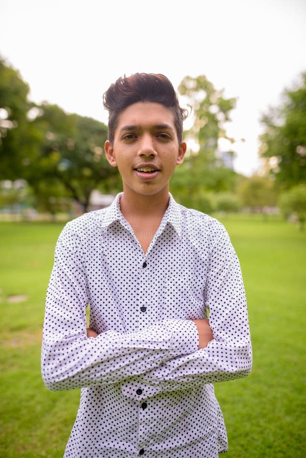 Portrait of Young Indian Teenage Boy Relaxing at the Park Stock Image ... Portrait of Young Indian Teenage Boy Relaxing at the Park Stock Image ...