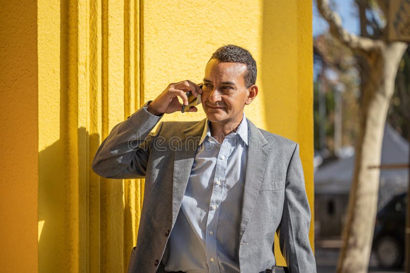Portrait of a Young Latino Man Talking on the Mobile Phone Stock Image ...