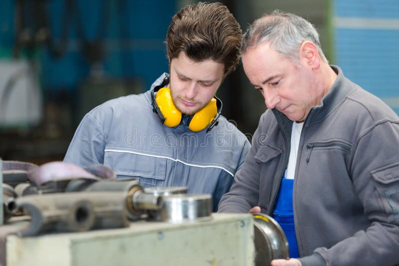 Young Machinist and Trainer Stock Image - Image of service, detail ...