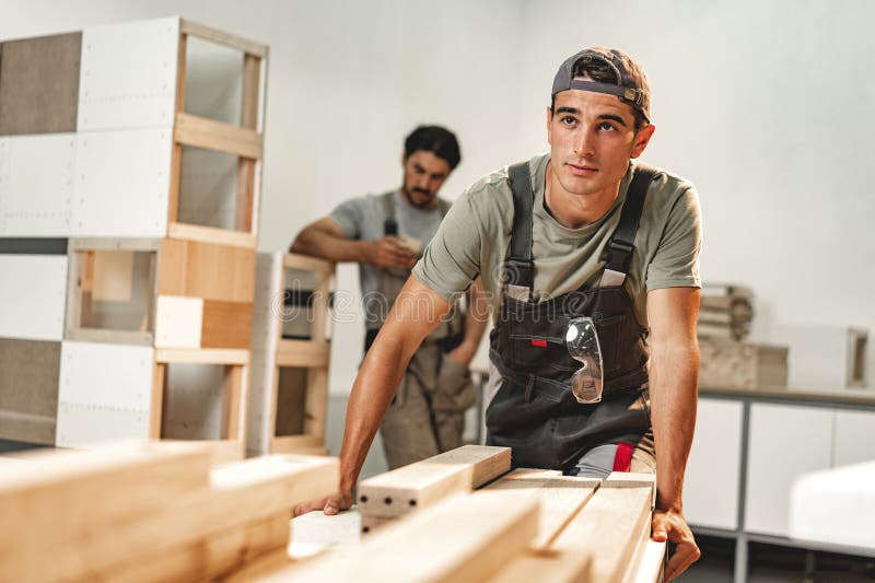 Portrait of Young Male Carpenter Standing in the Wood Workshop Stock ...