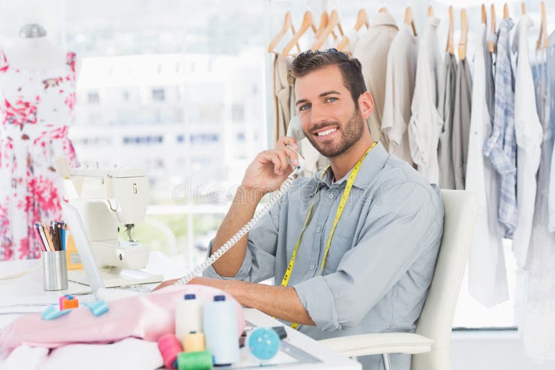 Portrait of a Young Male Fashion Designer Using Phone Stock Image ...