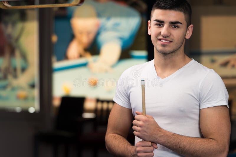 Portrait of a Young Male Model Playing Billards Stock Image - Image of ...