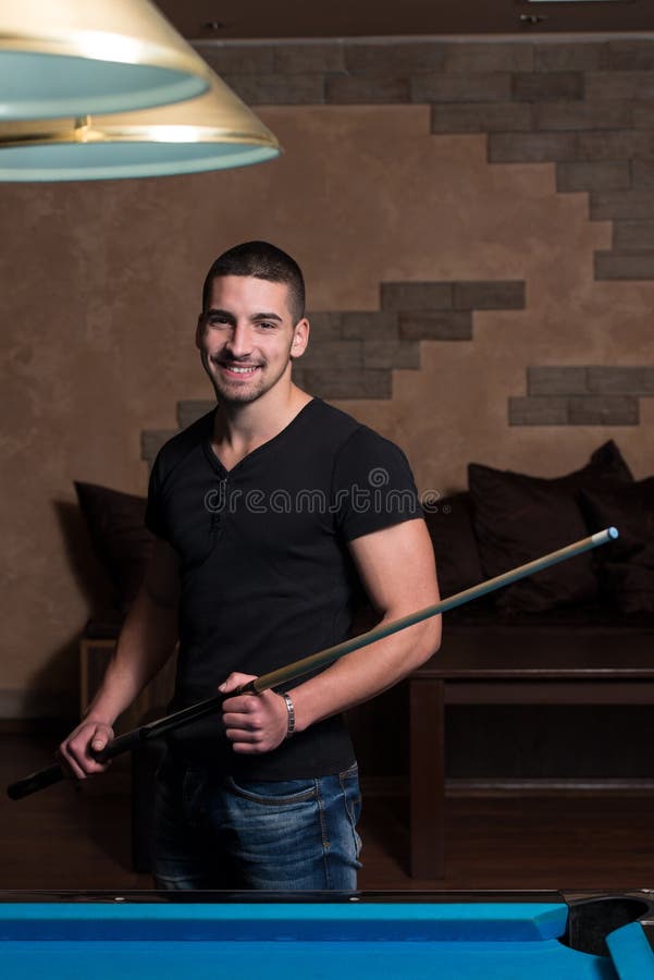 Portrait of a Young Male Model Playing Billiards Stock Image - Image of ...