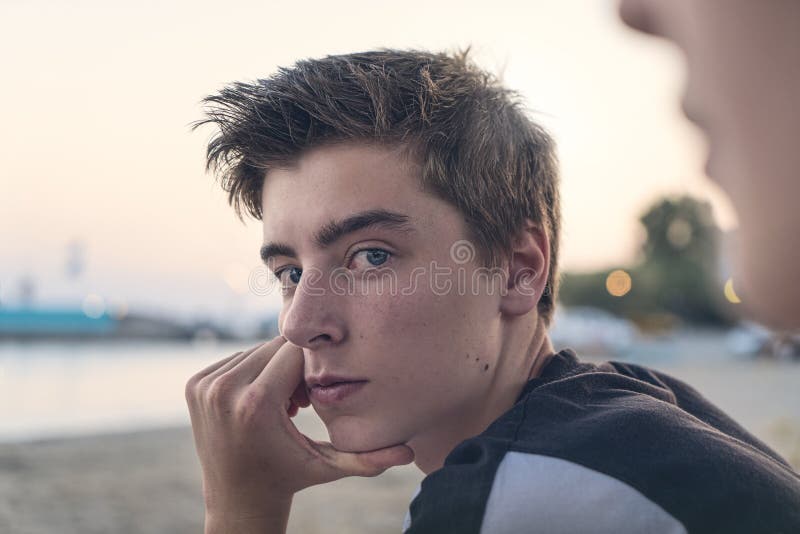 Young Man on the Beach in the Evening Sun Stock Photo - Image of ...