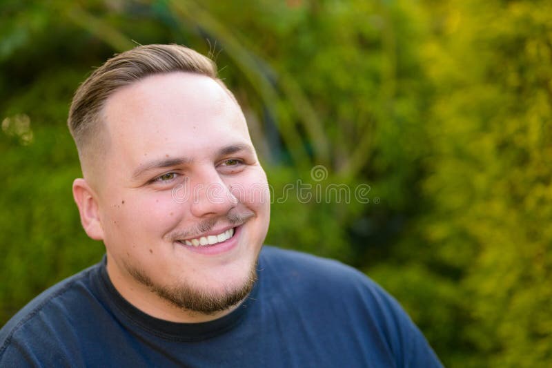 Portrait of a Young Man with a Beard Standing in the Garden Stock Image ...
