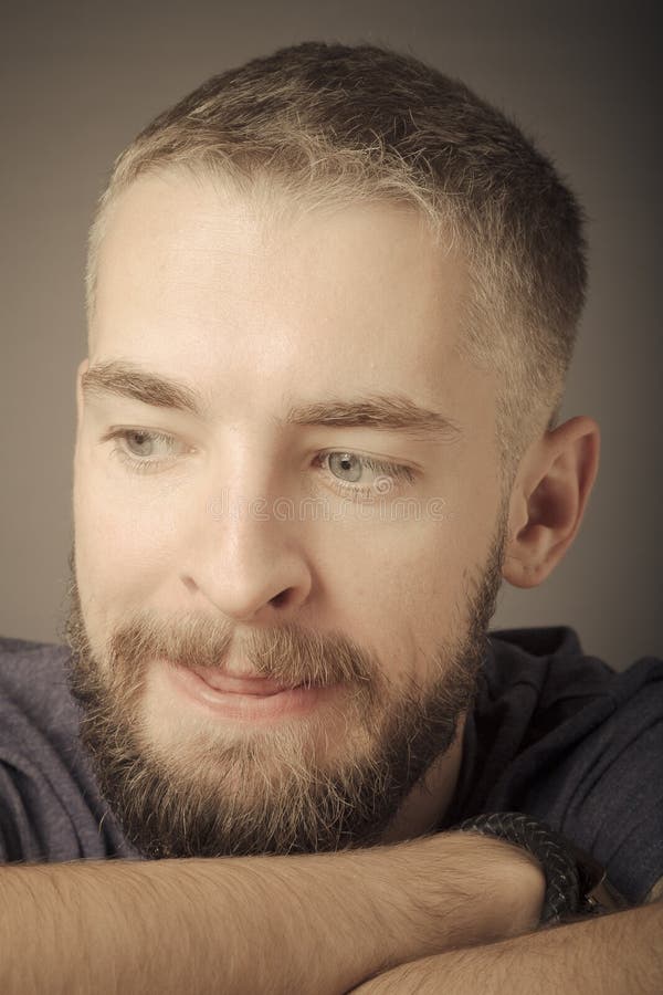 Portrait of a Young Man with a Beard. Toned Stock Image - Image of ...