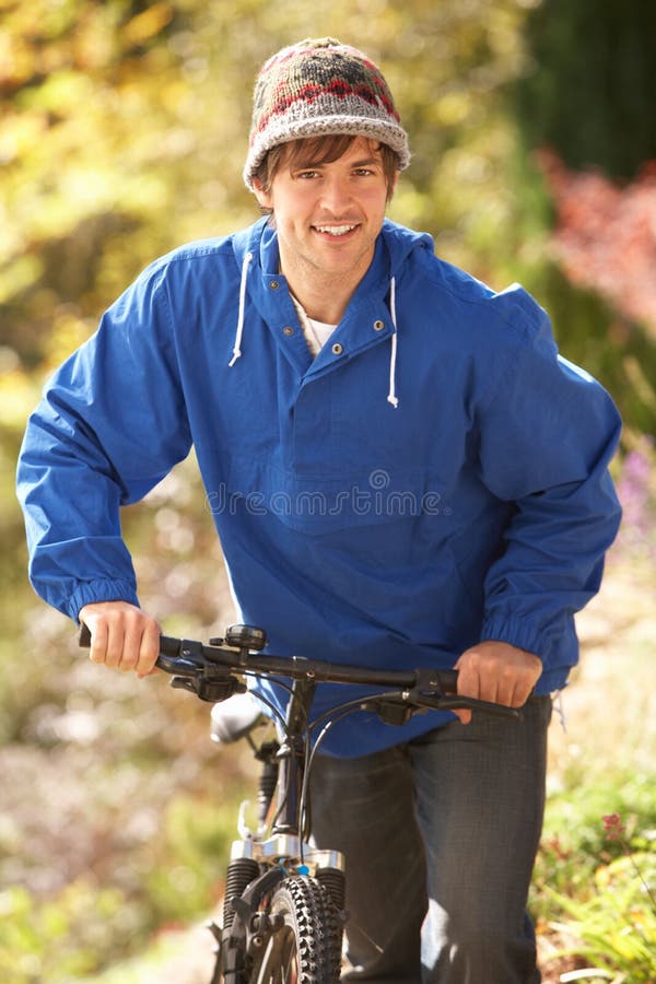 Portrait of Young Man with Cycle in Autumn Park Stock Photo - Image of ...