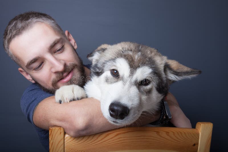 Portrait of a Young Man with a Dog Stock Image - Image of expressing ...