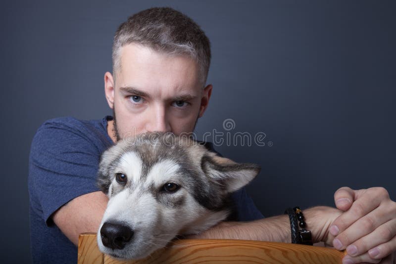 Portrait of a Young Man with a Dog Stock Image - Image of male, candid ...