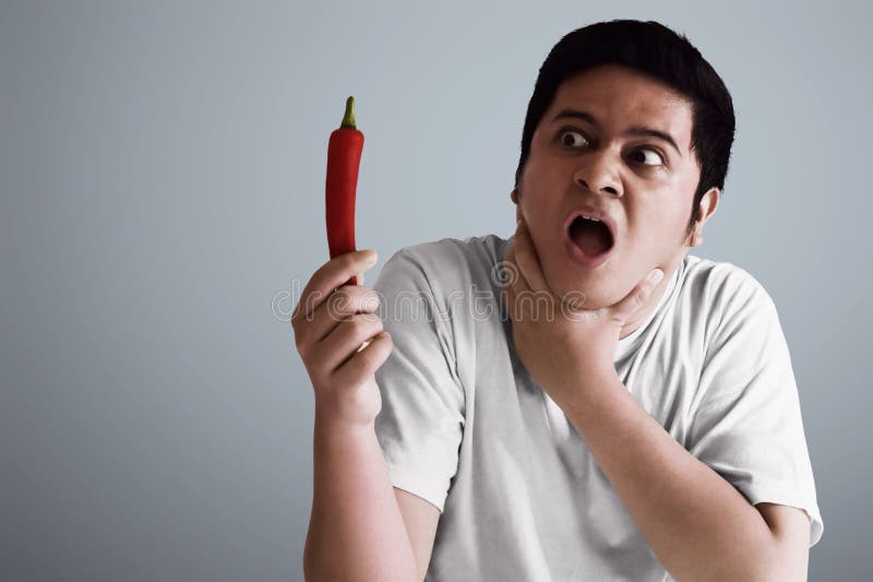 Young Man Eating Spicy Foods Stock Image - Image of fried, light: 220678969