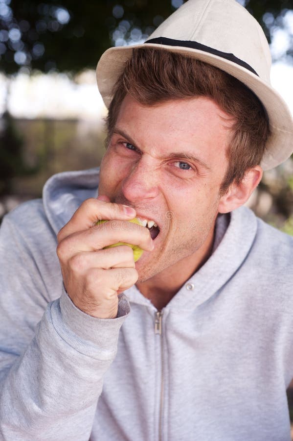 Portrait of a Young Man Eating Apple Stock Photo - Image of organic ...