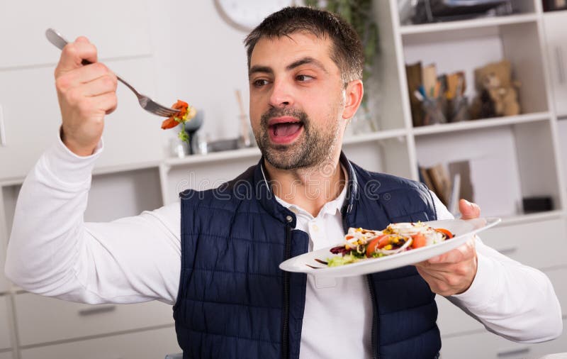 Portrait of Young Man Eating Vegetable Salad Stock Image - Image of ...