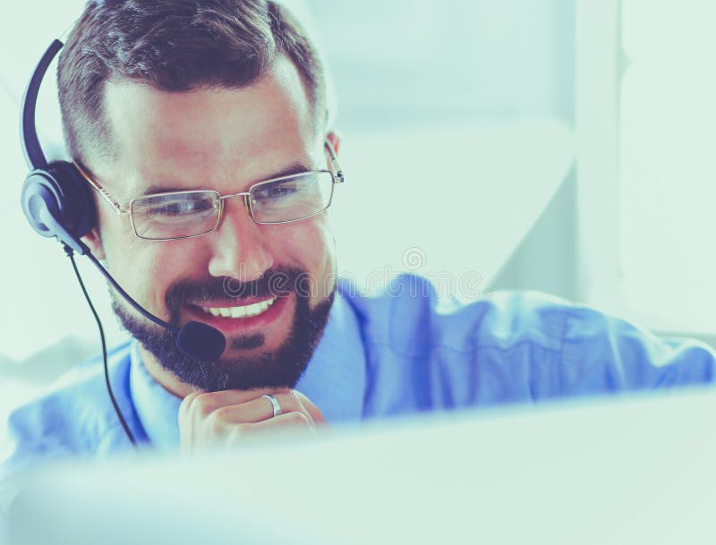 Portrait of a Young Man with a Headset in Front of a Laptop Computer ...