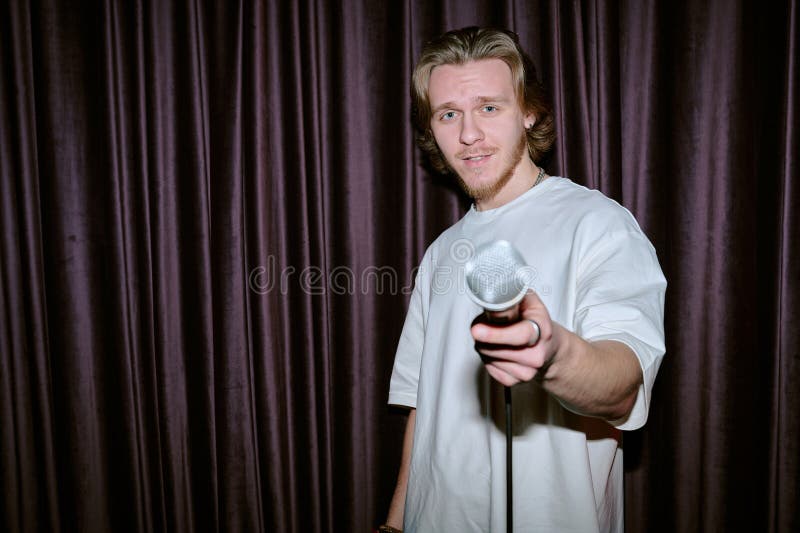Portrait Young Man Holding Microphone Pointing Forward Stock Photos ...