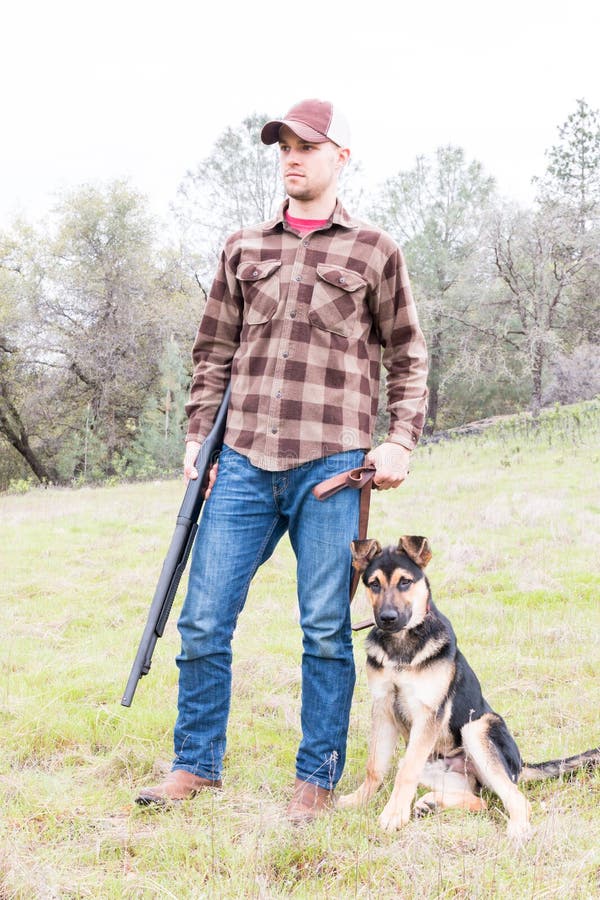 Portrait of Young Man Hunting with Dog Stock Image - Image of outdoors ...