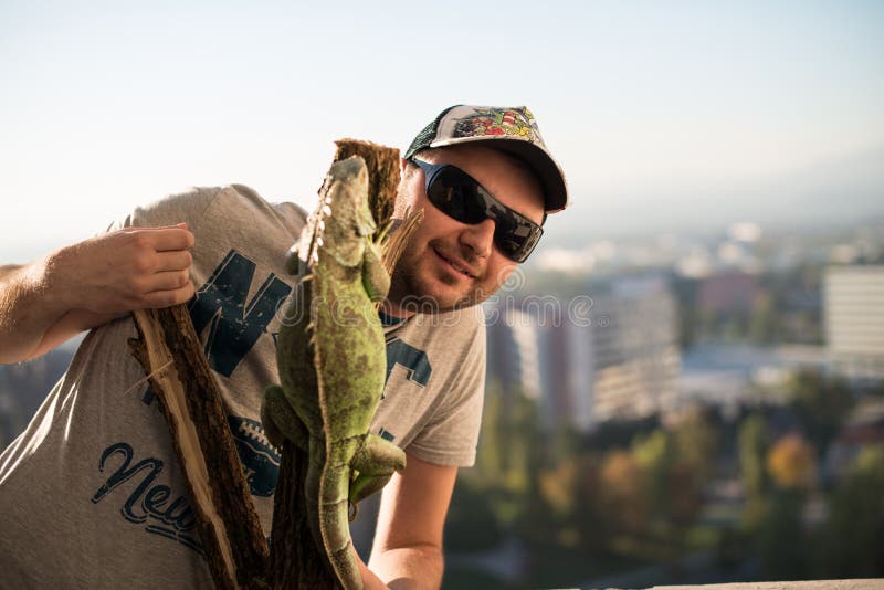 Portrait of the Young Man with the Iguana Stock Photo - Image of ...