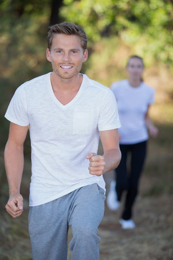 Portrait young man jogging stock photo. Image of green - 269560358