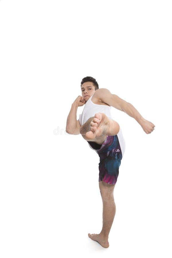 Portrait of Young Man Kicking Stock Image - Image of handsome, angry ...