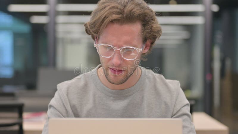 Portrait of Young Man with Laptop Having Loss, Failure Stock Photo ... Portrait of Young Man with Laptop Having Loss, Failure Stock Photo ...