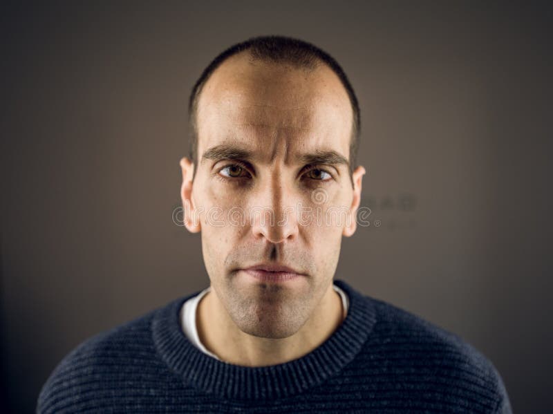 Portrait of a Young Man Looking at the Camera with Serious Expression ...